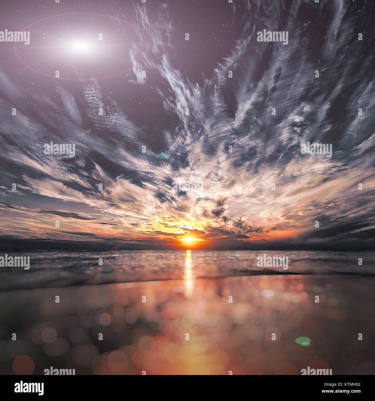 Beautiful sunset on the beach, flash in outer space Stock Photo - Alamy