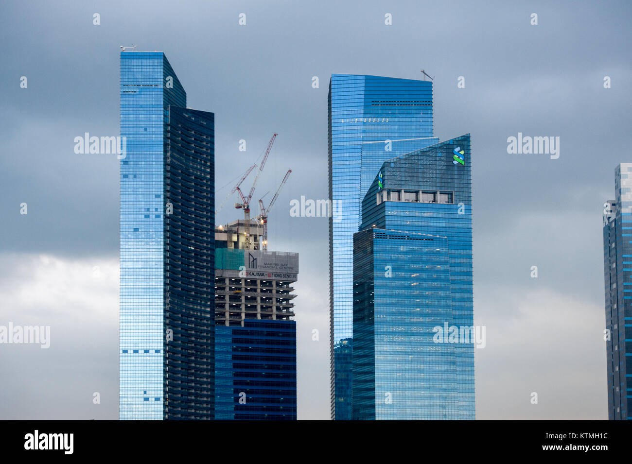 SINGAPORE – february 27, 2011 : building a base of a new skyscraper ...