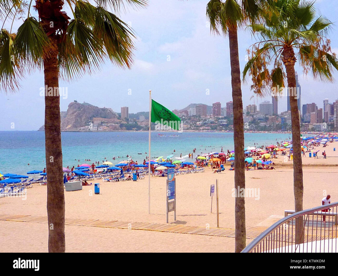 This image shows the Playa de Poniente beach in Benidorm, Spain, known ...