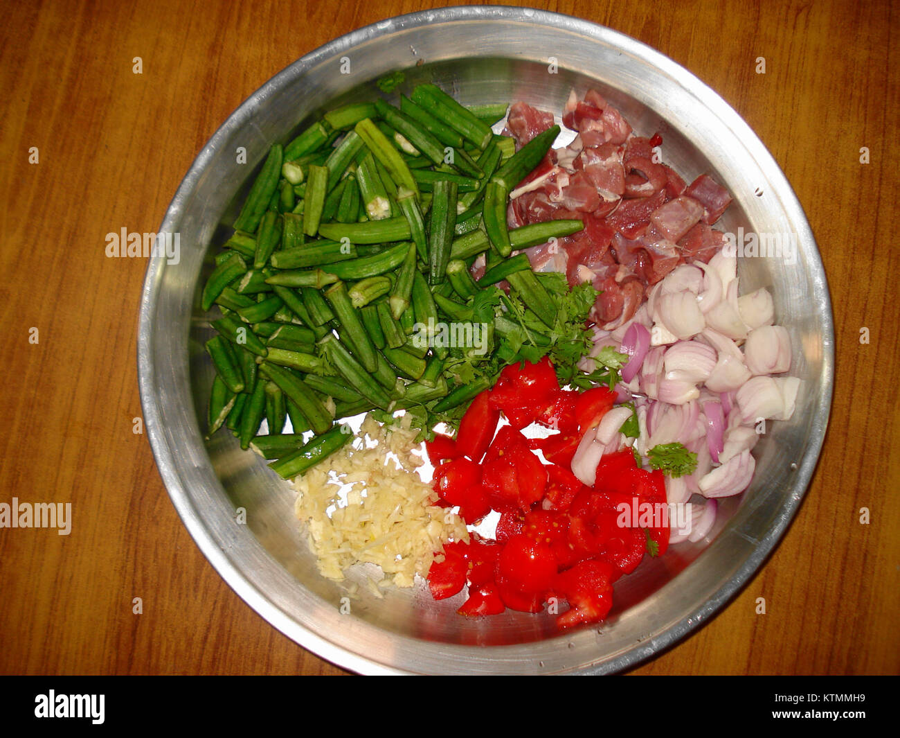The image 'Bamje ingredients after cutting' shows the preparation of ...