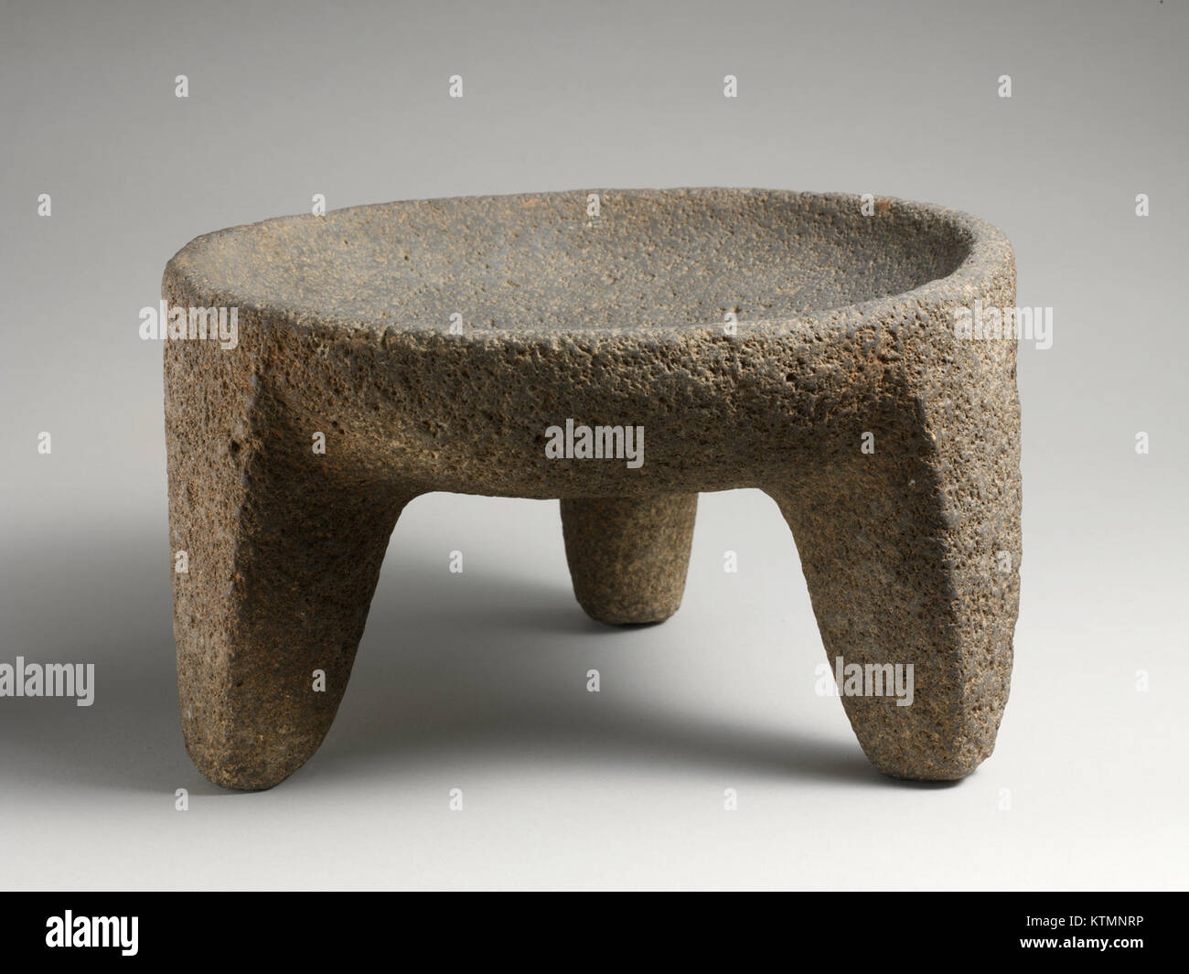 Basalt mortar, part of the ancient tool collection, represents an early ...