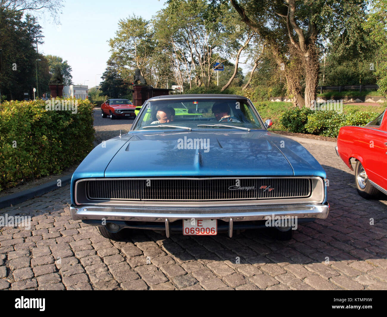 This photo features a Belgian Dodge Charger R/T, a high-performance ...