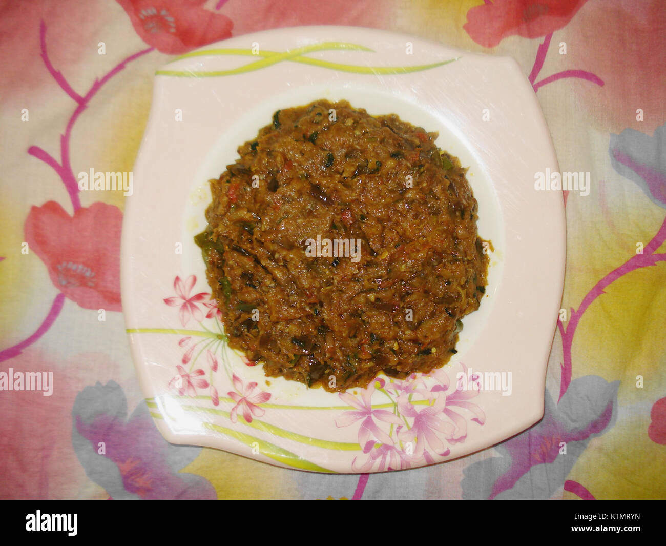 A traditional Indian dish known as Baingan Ka Bhurta, featuring roasted ...