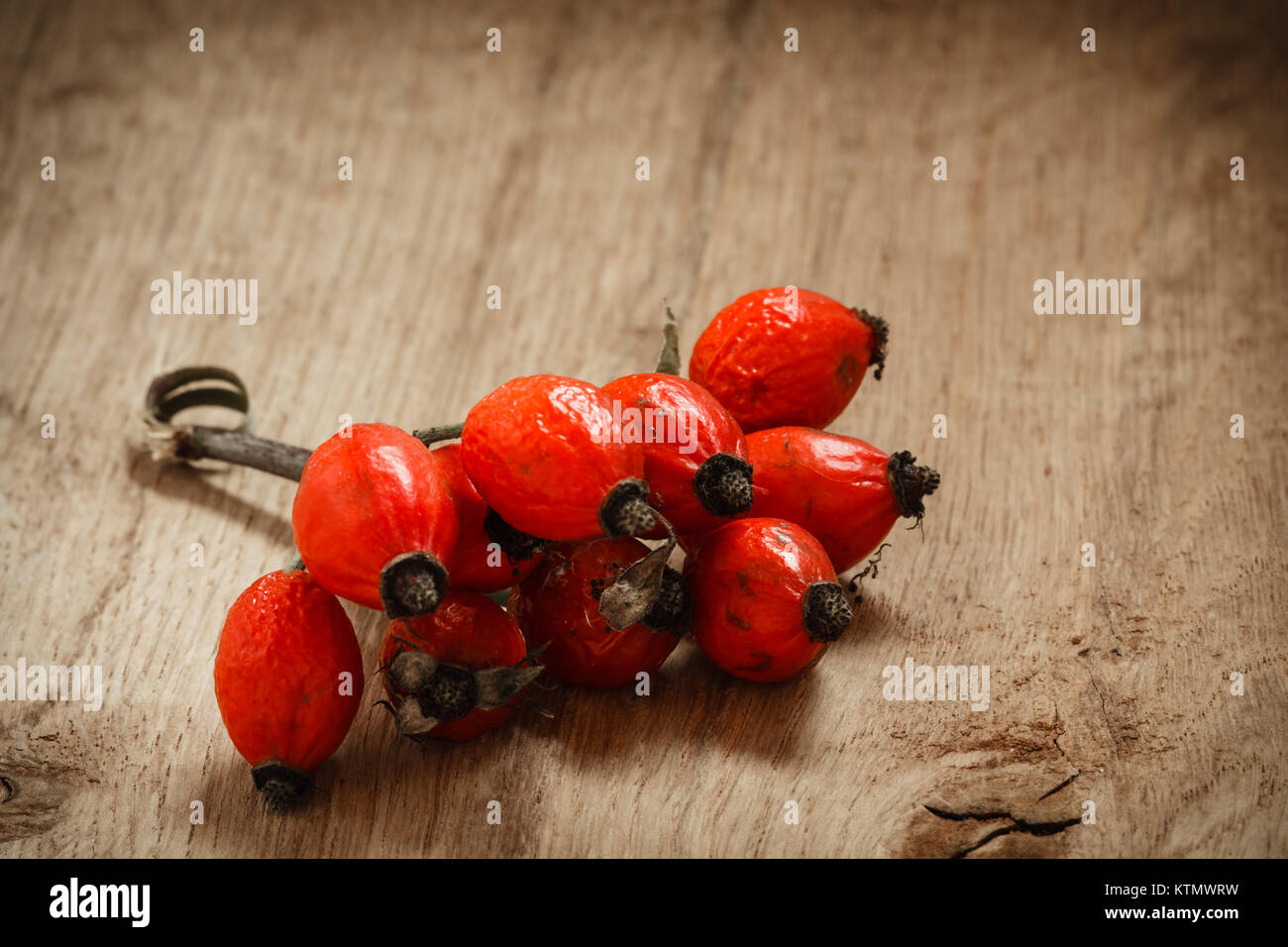 Hawthorn on wooden rustic table background. Rose hips haw fruit of the ...