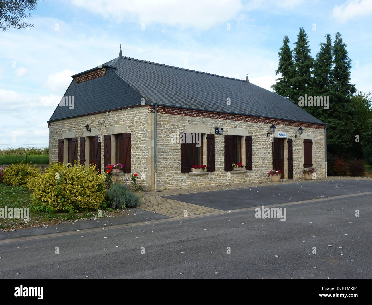 This image shows the town hall (mairie) of Auge in the Ardennes, France ...