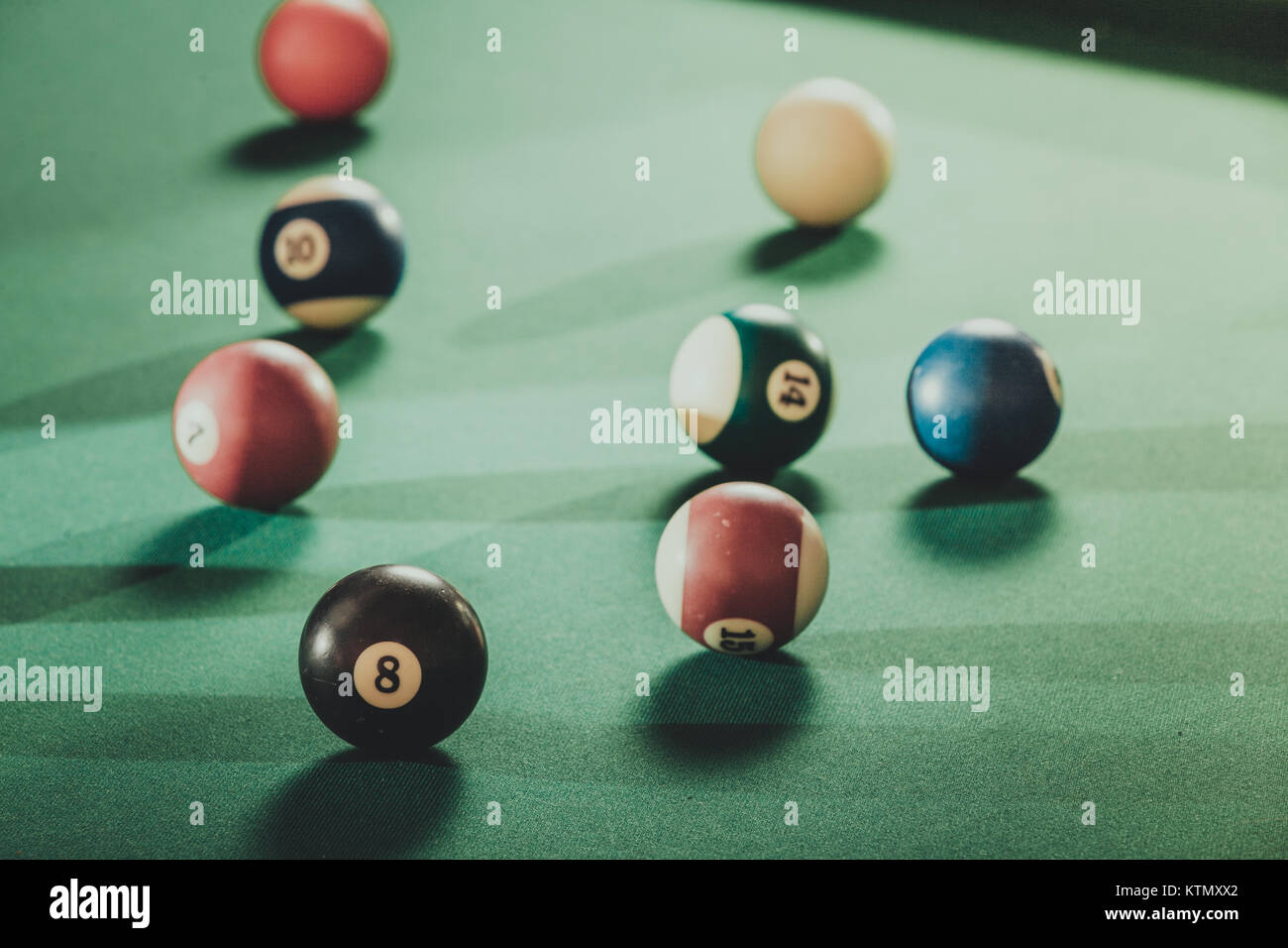 Billiard cue balls on green table. Pool game Stock Photo - Alamy