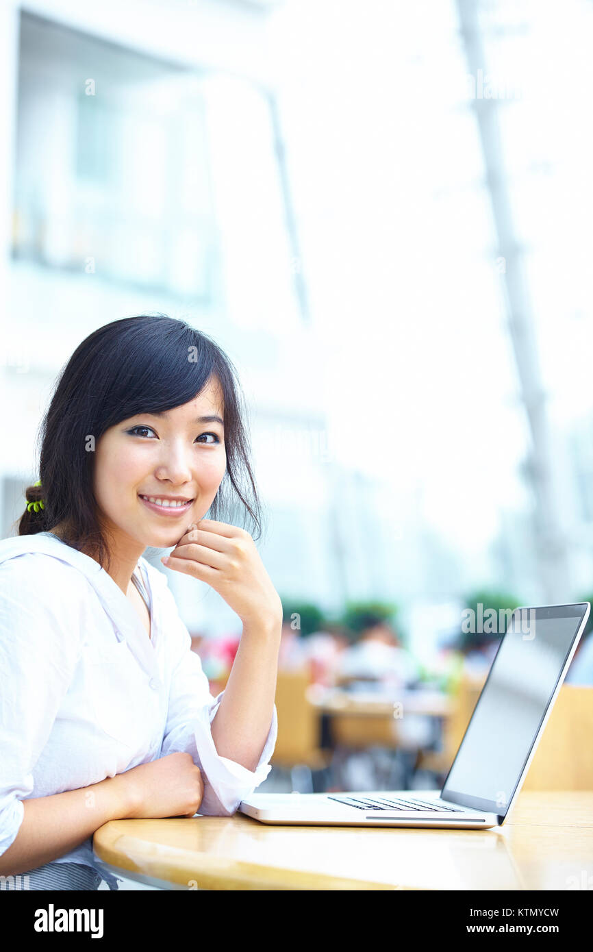 one pretty young Chinese college student in library Stock Photo - Alamy