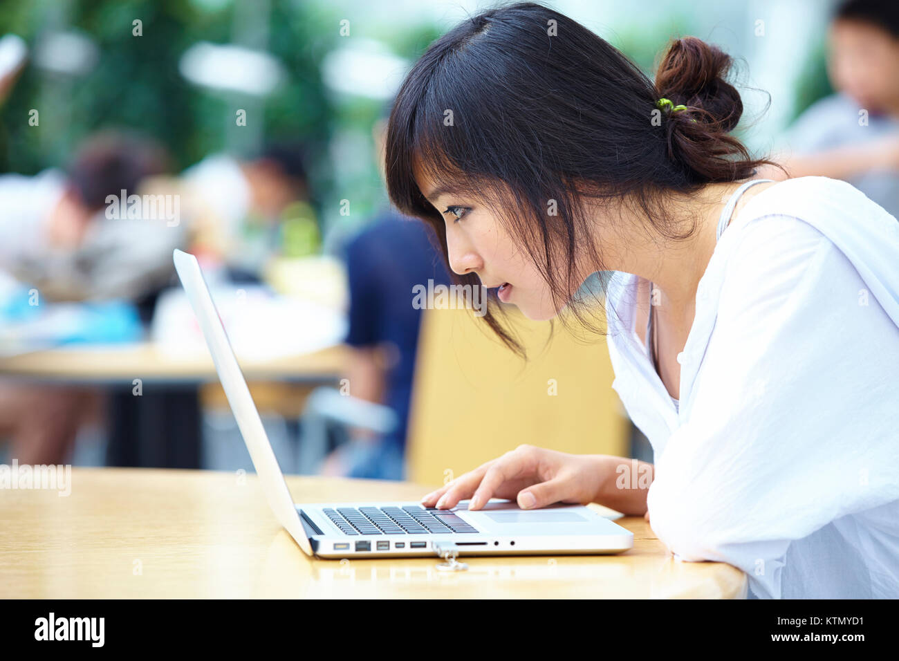 one pretty young Chinese college student in library Stock Photo - Alamy