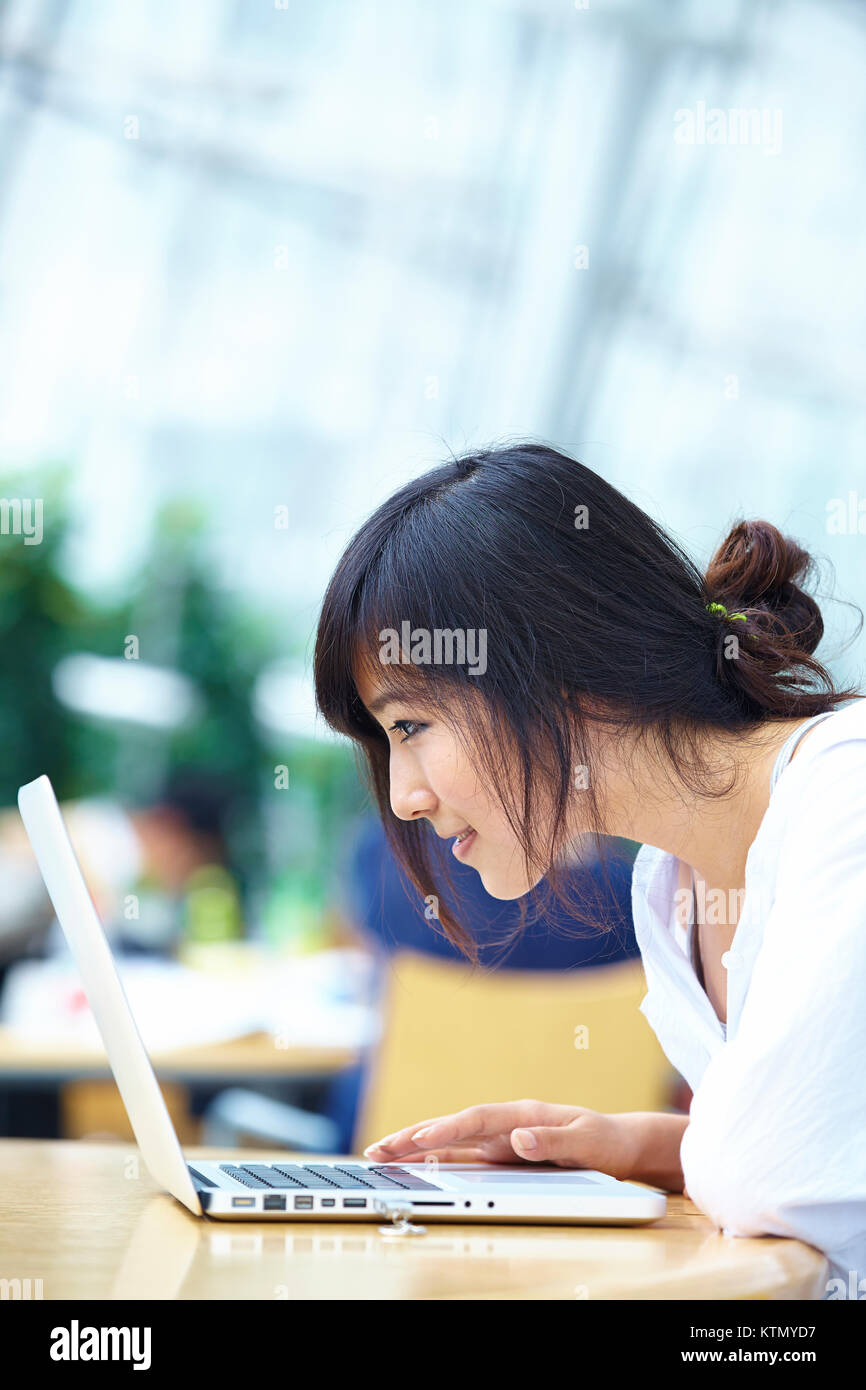 one pretty young Chinese college student in library Stock Photo - Alamy