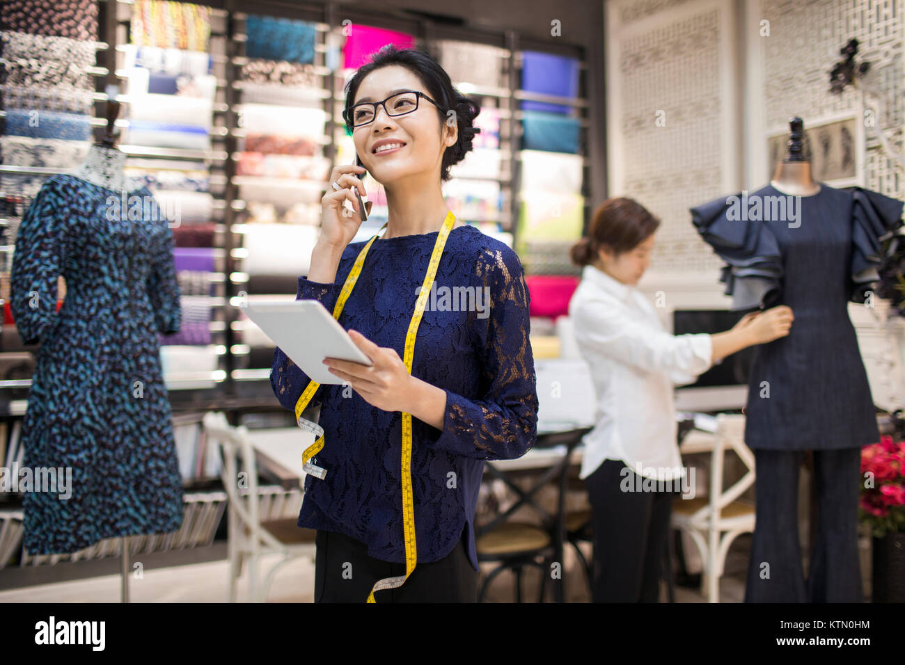 Confident fashion designer working Stock Photo - Alamy