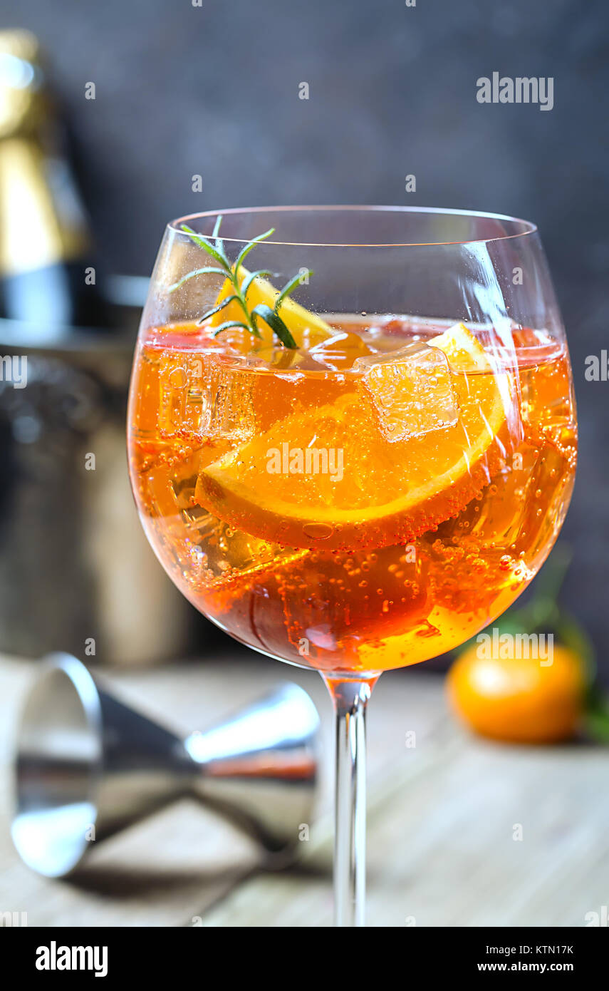 Classic Italian Aperol spritz cocktail in glass on wooden table Stock ...