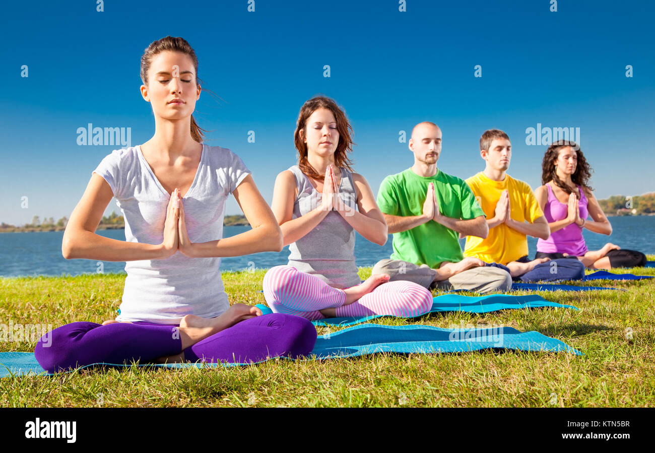 Group of young people have meditation on yoga class. Yoga concept Stock ...