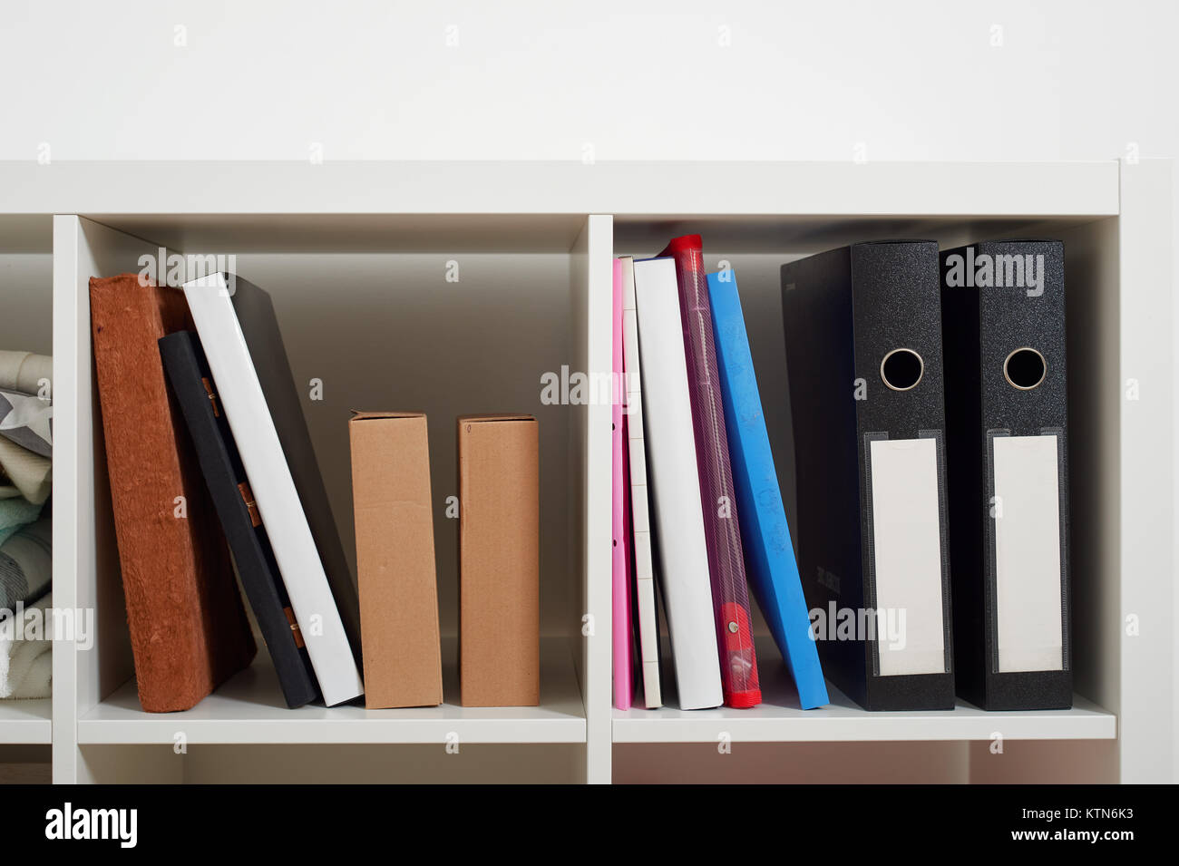 white rack with shelves full of stuff Stock Photo - Alamy