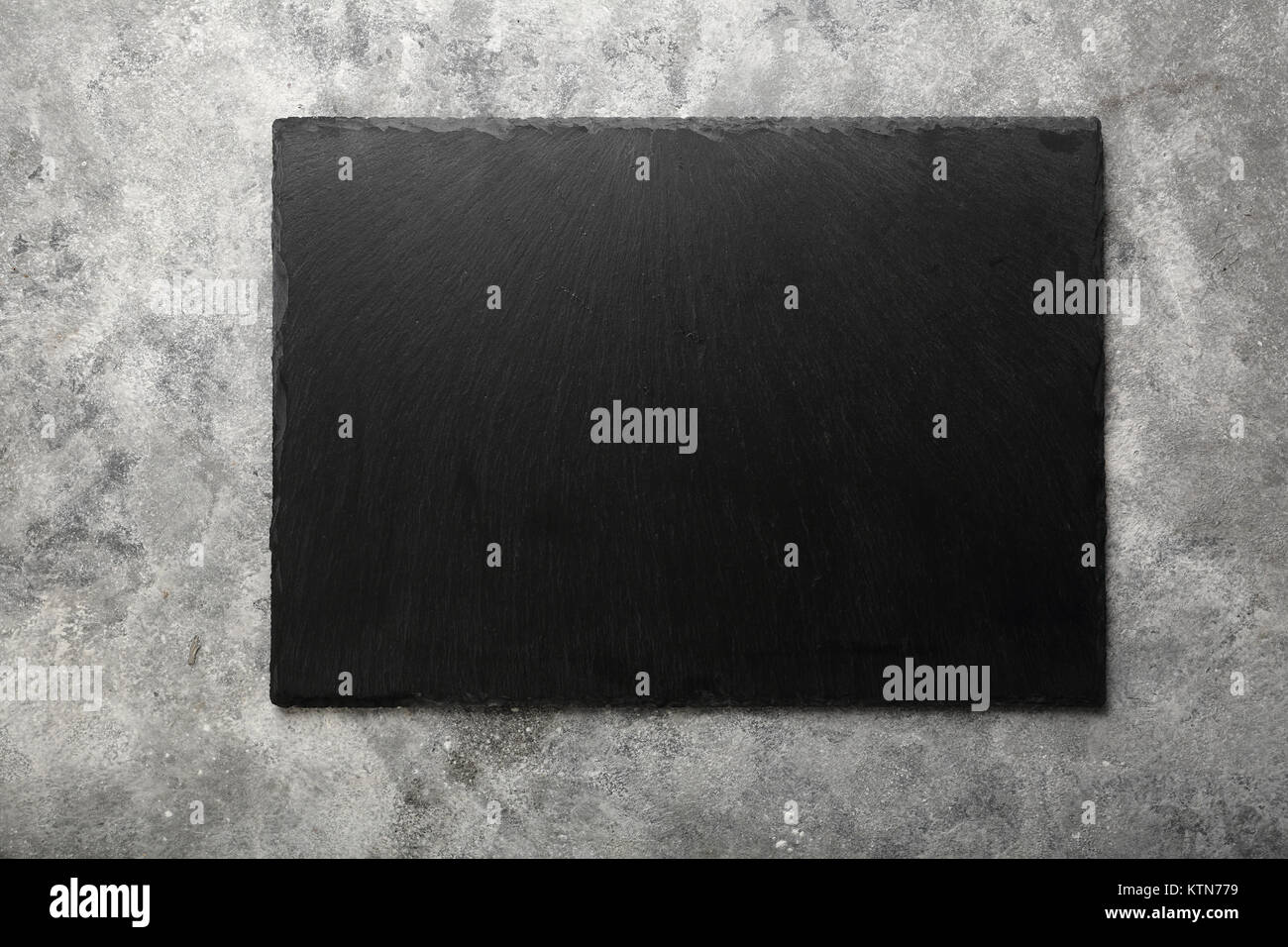 Slate board on loft background Stock Photo - Alamy