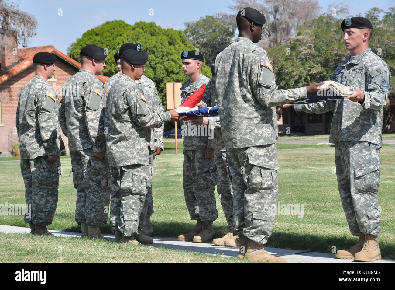 Fort Bliss Soldiers carefully fold the National Colors during the Fort ...