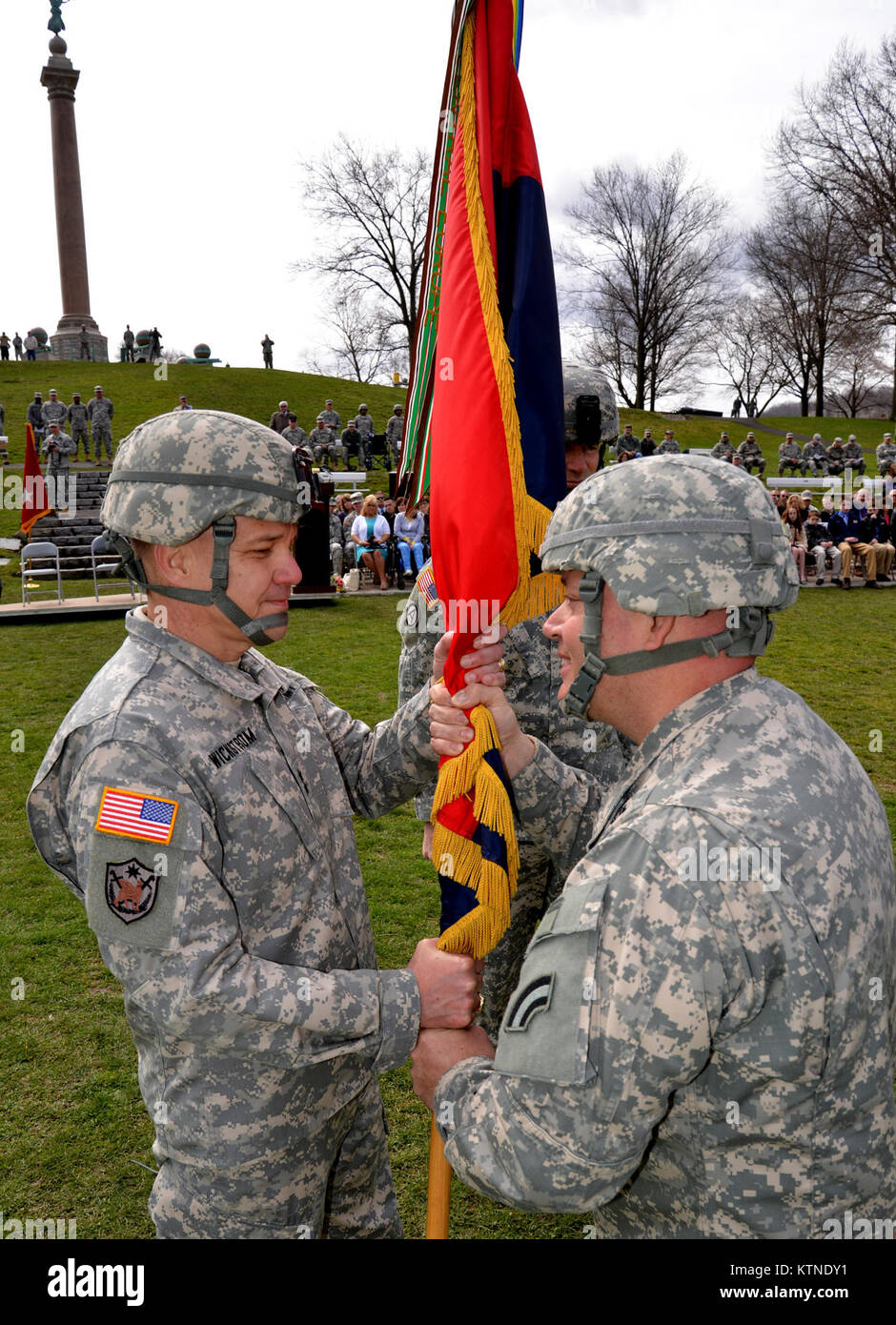 Command Sgt. Major Robert Jenks passes the division colors to Major ...