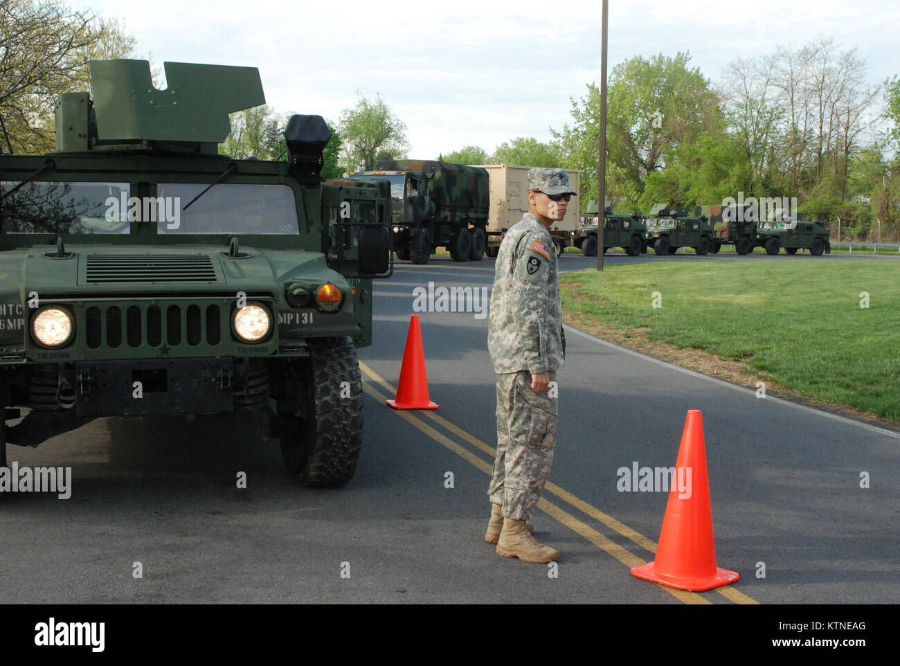 LATHAM-- Army National Guard Spec. Andrew Olivers directs traffice ...