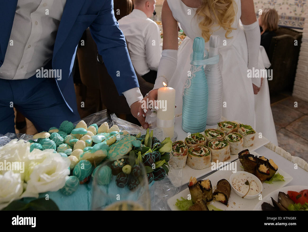 Close up image of newlywed couple's hands touching candle Stock Photo ...