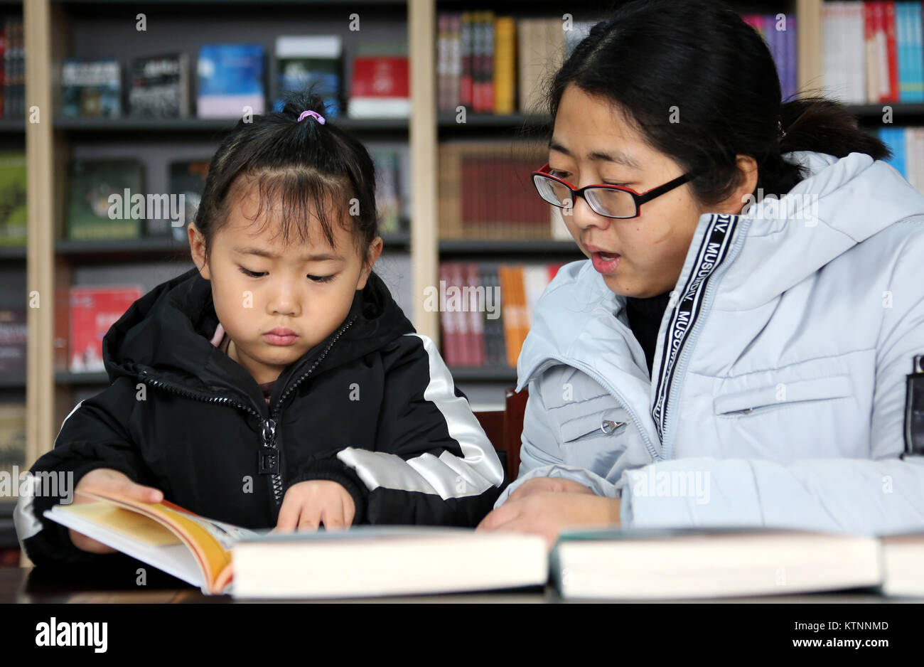 Zaozhuang, China's Shandong Province. 27th Dec, 2017. People read at an ...