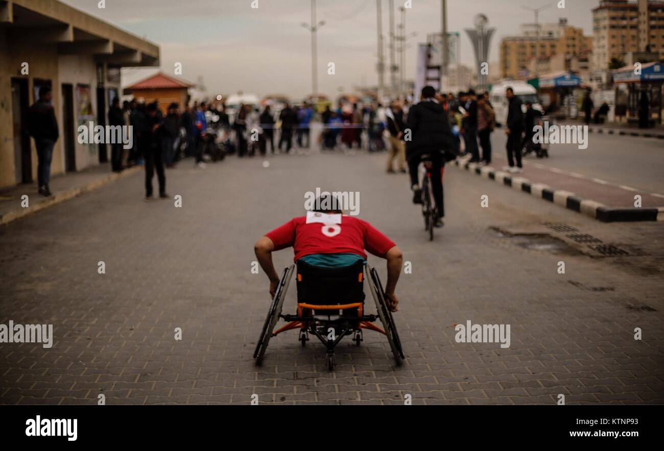 A Palestinian disabled man takes part in a wheelchair marathon at the ...