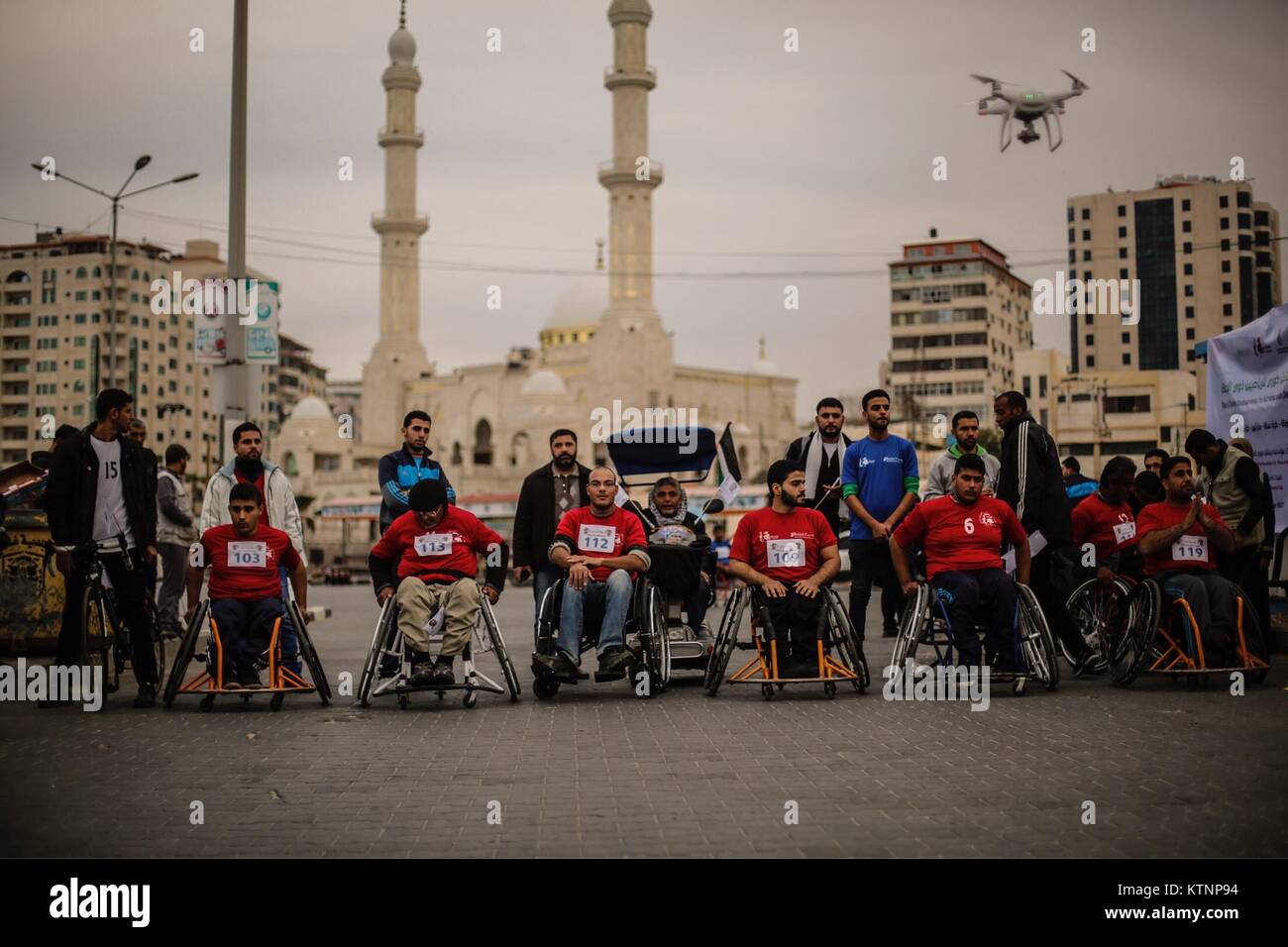 Palestinian disabled men prepare before taking part in a wheelchair ...