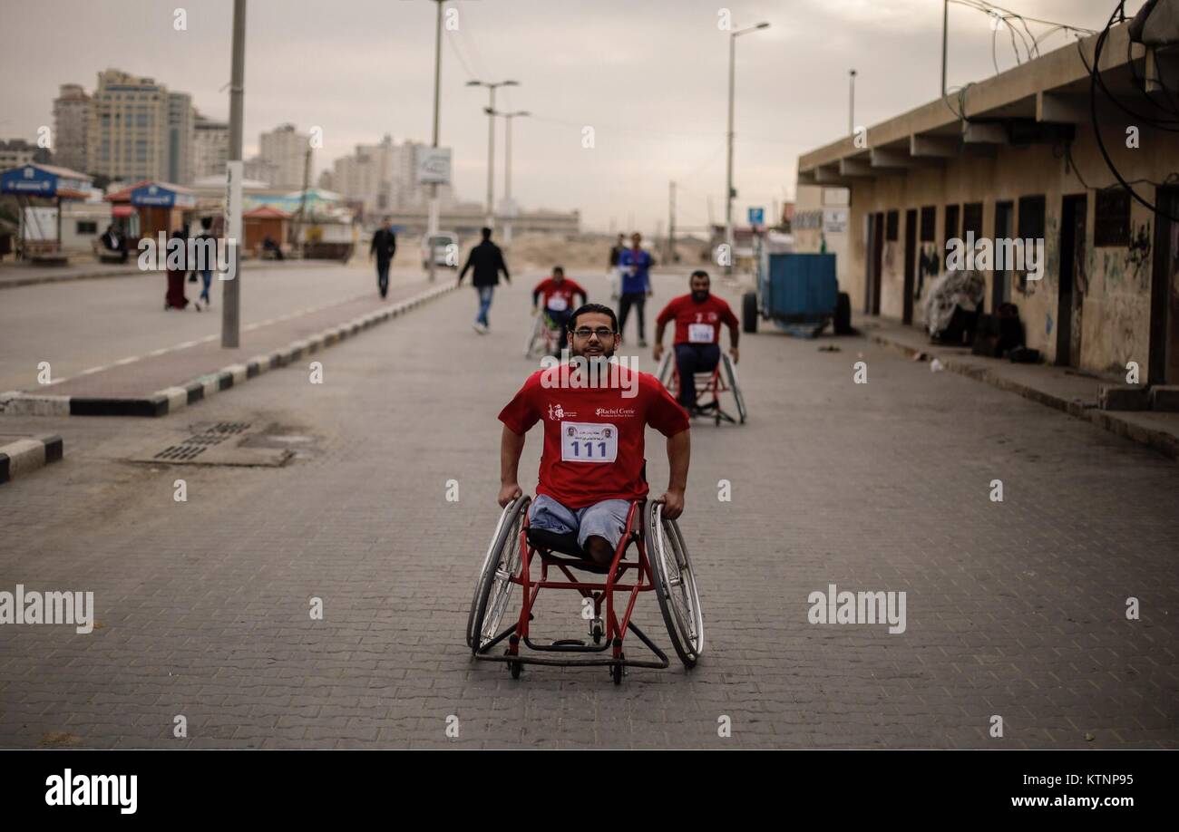 A Palestinian disabled man takes part in a wheelchair marathon at the ...