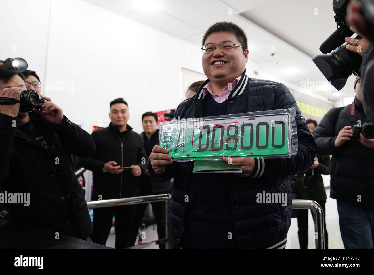 Beijing, China. 28th Dec, 2017. A driver receives Beijing's first ...