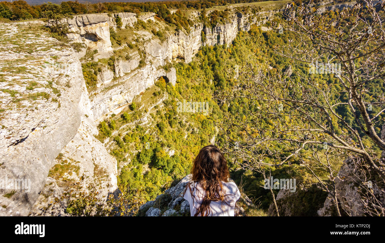 Woman at the edge of deep precipice Stock Photo - Alamy