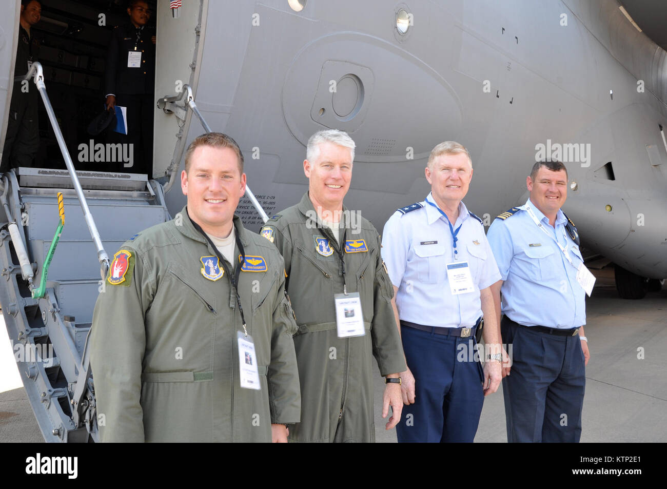 (From left) Cpt. Ryan Daughtery, Col. Thomas McEntee, C-17 pilot and ...