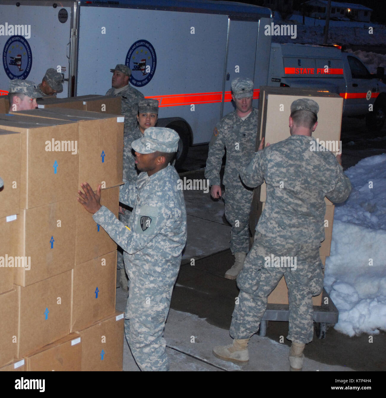 THIELLS, NY -- New York Army National Guard troops unload boxes of ...