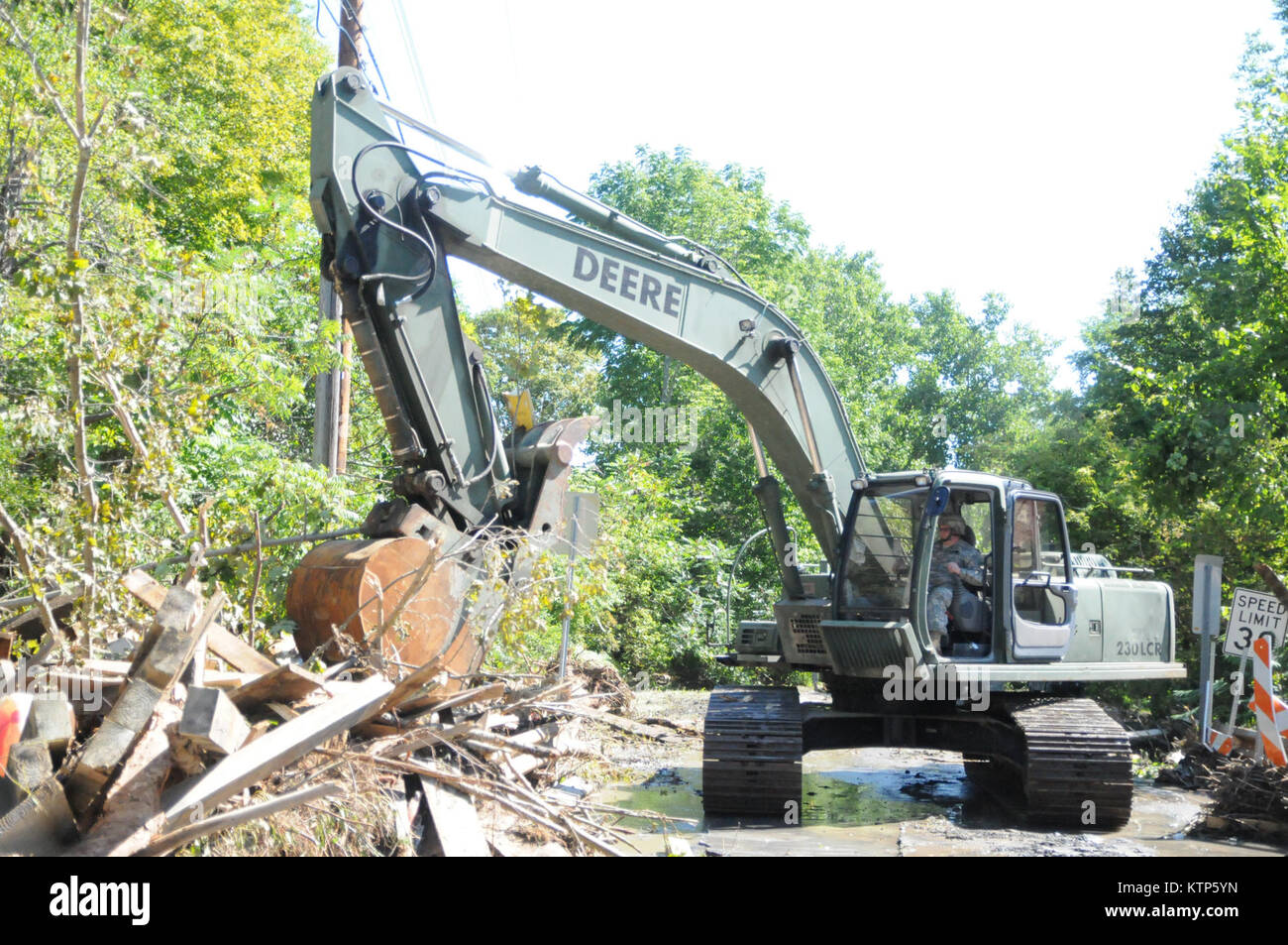 National Guard Soldiers with the 204th Engineers Battalion clear debris ...