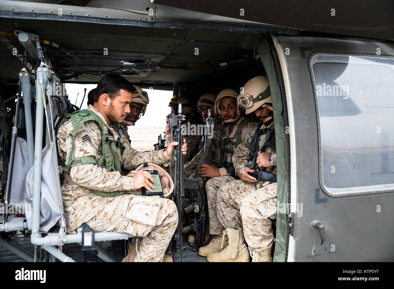 Royal Saudi Land Forces (RSLF) soldiers load onto a UH-60 Black Hawk ...