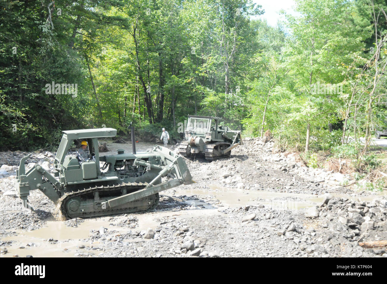 National Guard Soldiers with the 204th Engineers Battalion clear debris ...