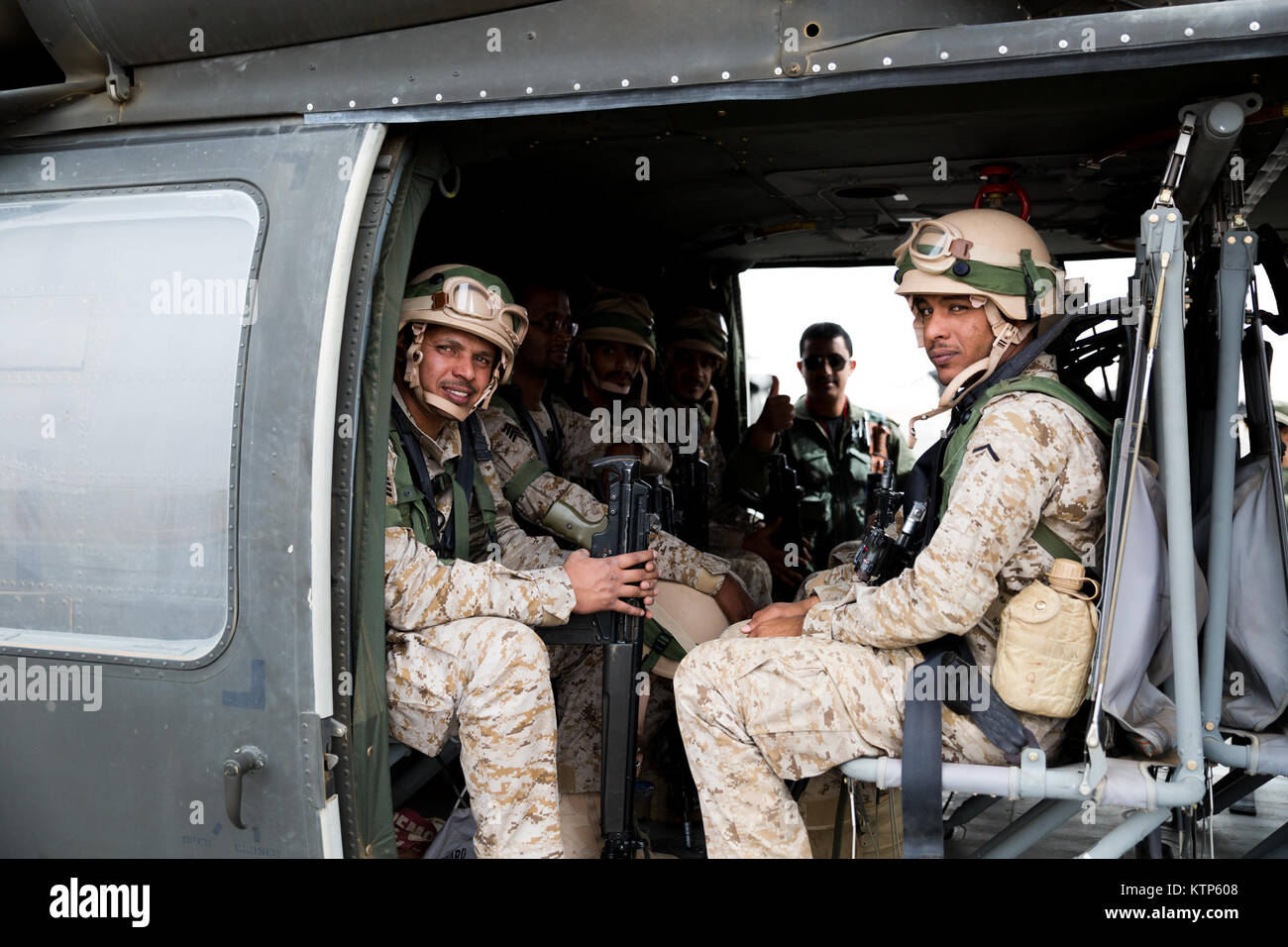 Royal Saudi Land Forces (RSLF) soldiers load onto a UH-60 Black Hawk ...