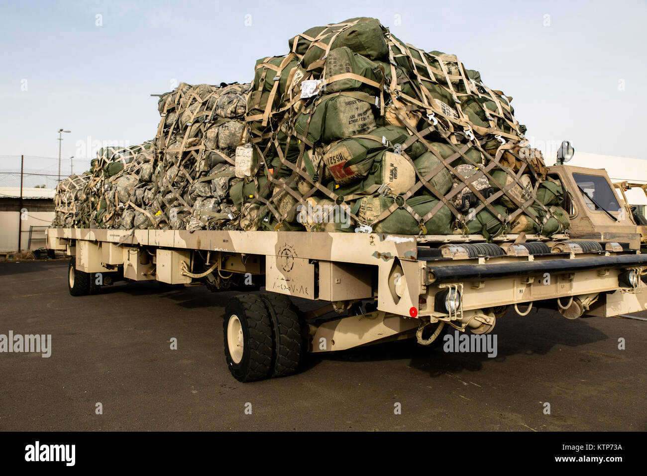U.S. Army soldiers from the 42nd Combat Aviation Brigade load their ...