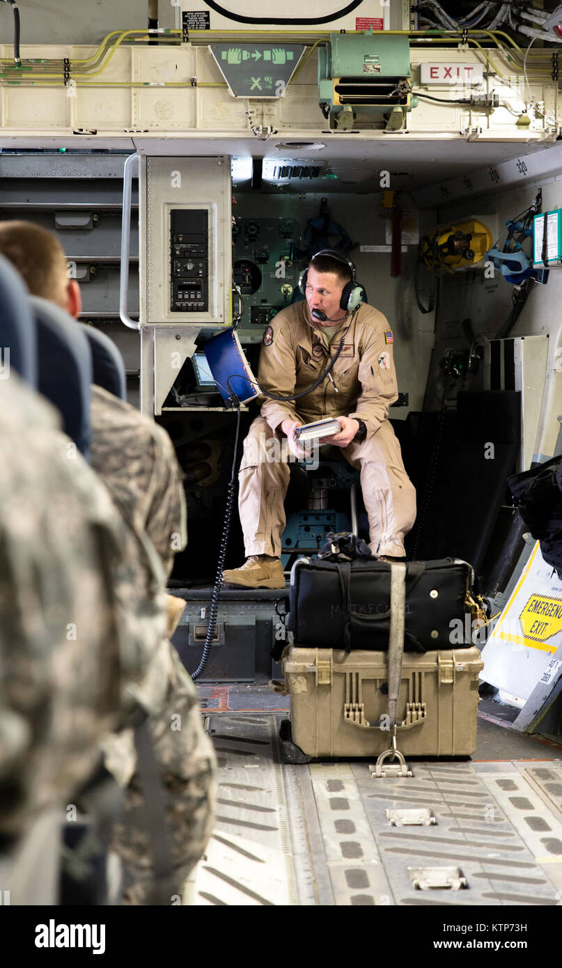 U.S. Army soldiers from the 42nd Combat Aviation Brigade load their ...