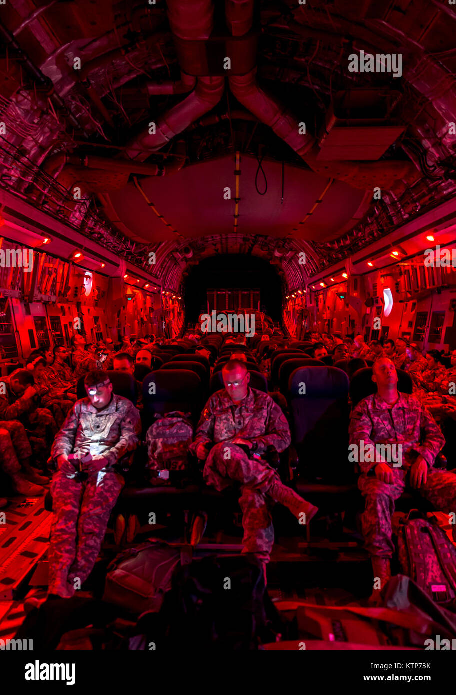 U.S. Army soldiers from the 42nd Combat Aviation Brigade load their ...