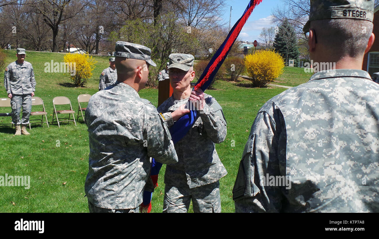 Lt. Col. Henry S. Pettit accepts the battalion colors from outgoing ...