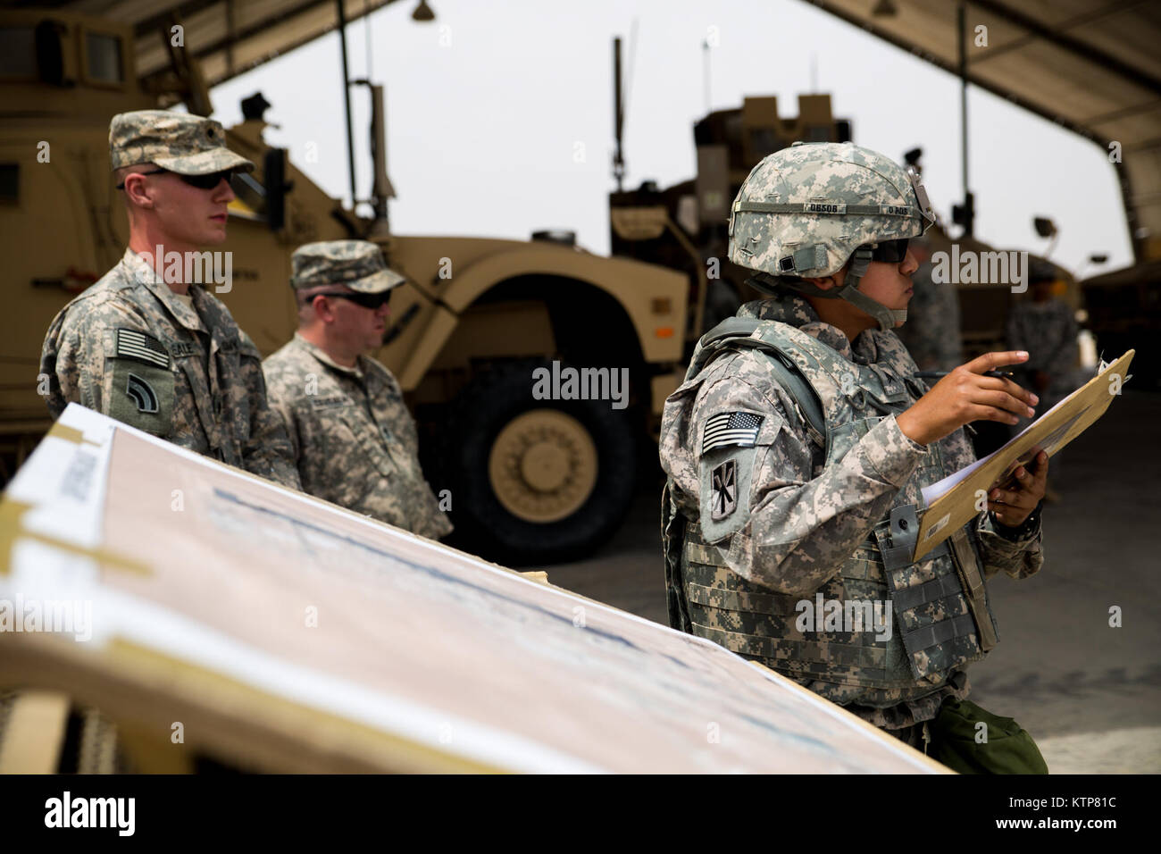 Soldiers from the 42nd Combat Aviation Brigade (CAB) assist in running ...
