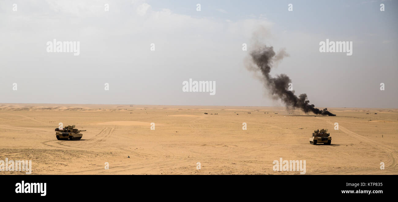 Two M1 Abrams tanks operated by the 4th Infantry Division prepare to ...