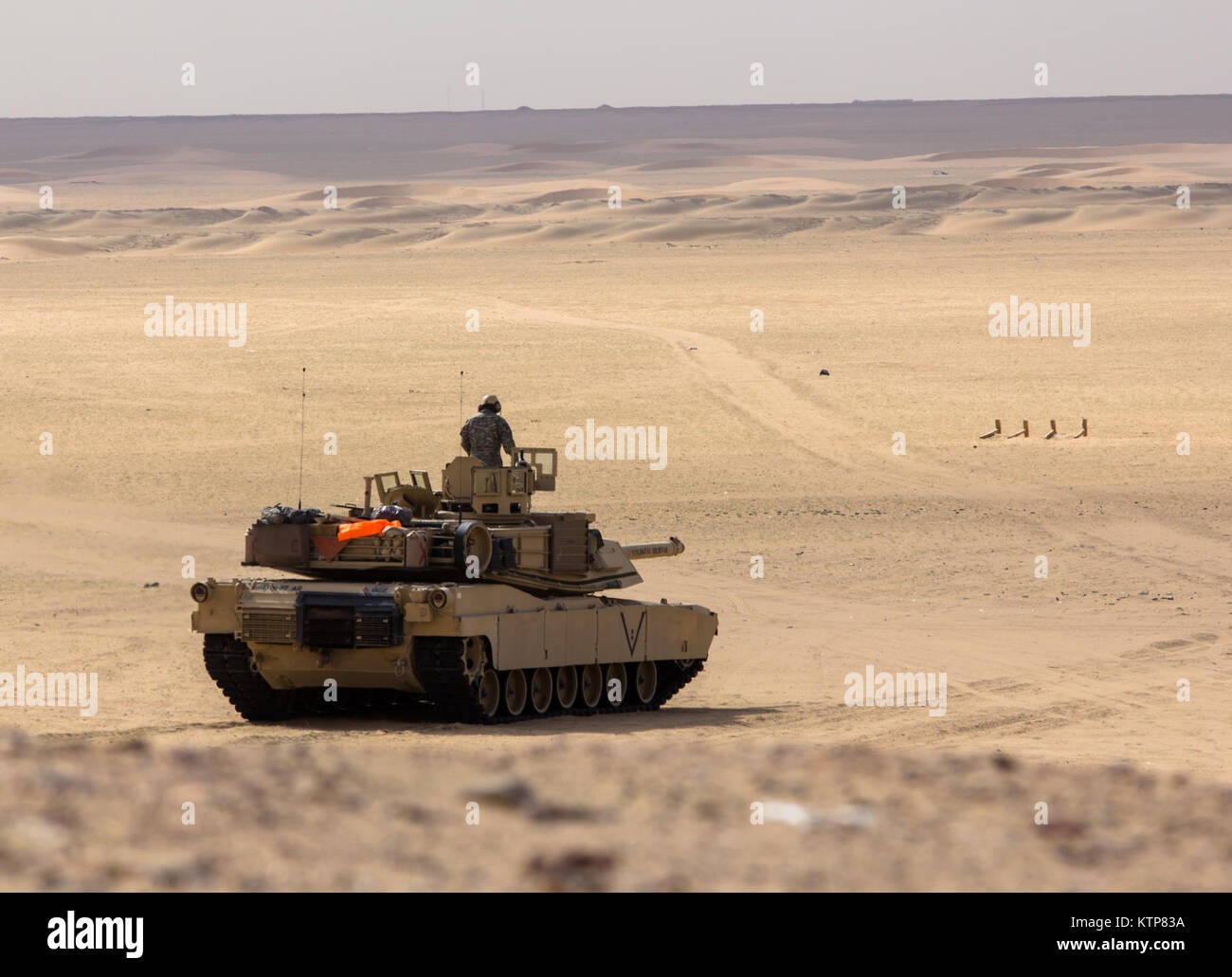 An M1 Abrams tank prepares to fire during a Joint Air Attack Team ...