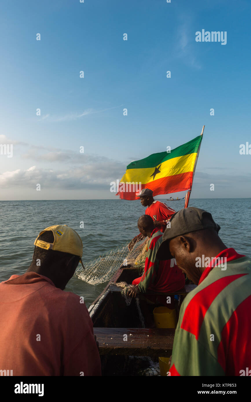 Fishermen in their open boat go fishing in the early morning. They ...