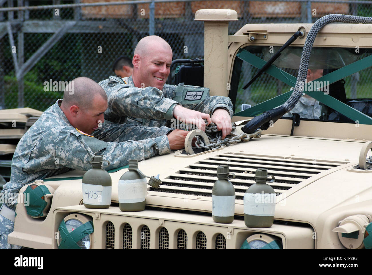 Sgt. Adam Tice of HHD 102nd MP Battalion and Chief Warrant Officer 2nd ...