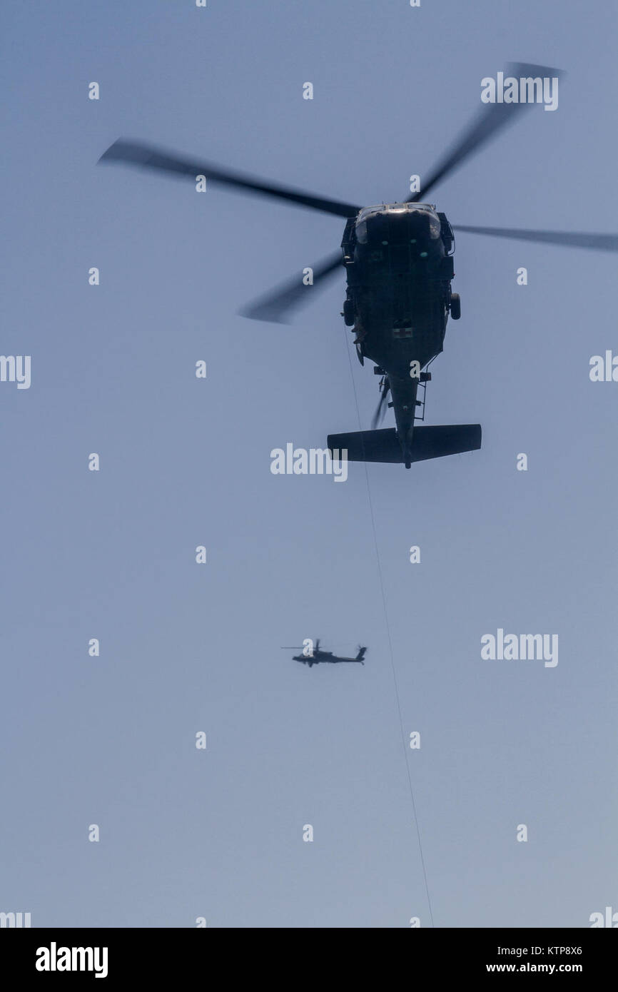 Soldiers of the 42nd Combat Aviation Brigade (CAB) work with Army ...