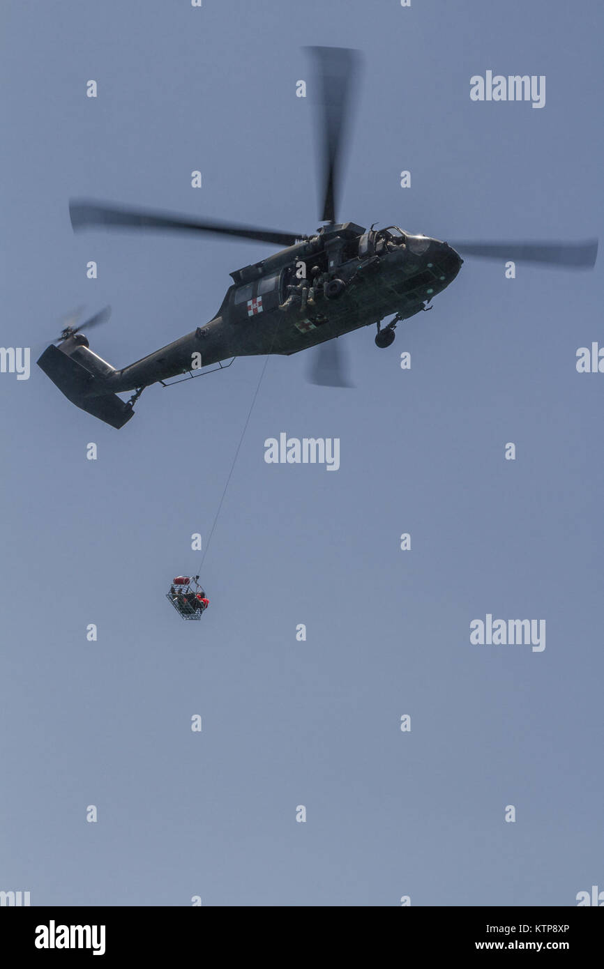 Soldiers of the 42nd Combat Aviation Brigade (CAB) work with Army ...