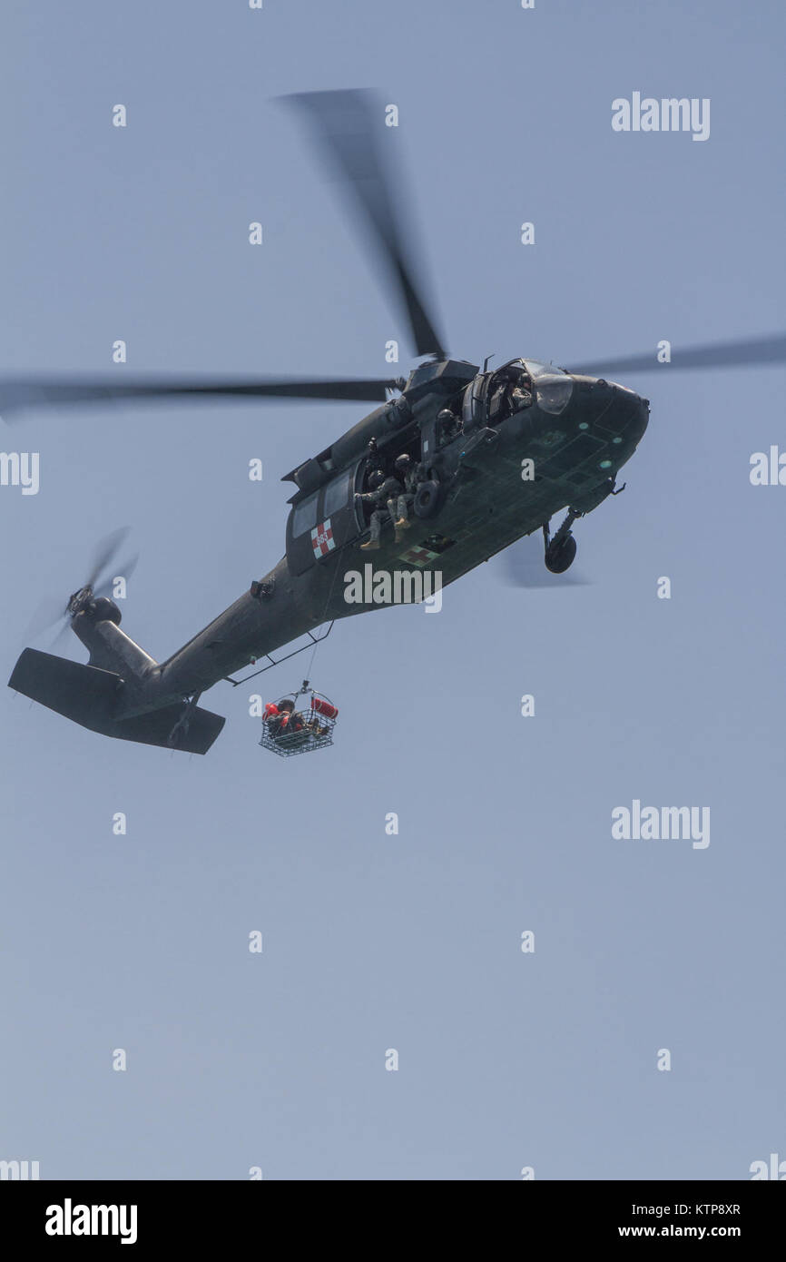 Soldiers of the 42nd Combat Aviation Brigade (CAB) work with Army ...