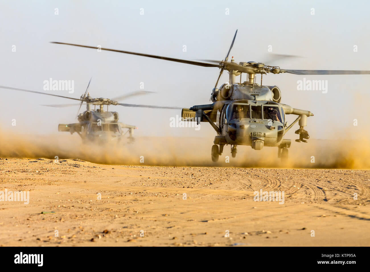 Two Navy MH-60S Sea Hawk helicopters from the aircraft carrier USS ...