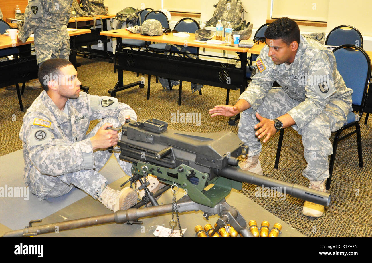 New York Army National Guard Staff Sgt. Juan Torres (right), an ...