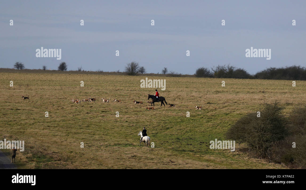 Riders pass over Salisbury Plain during the Tedworth Boxing Day hunt in ...