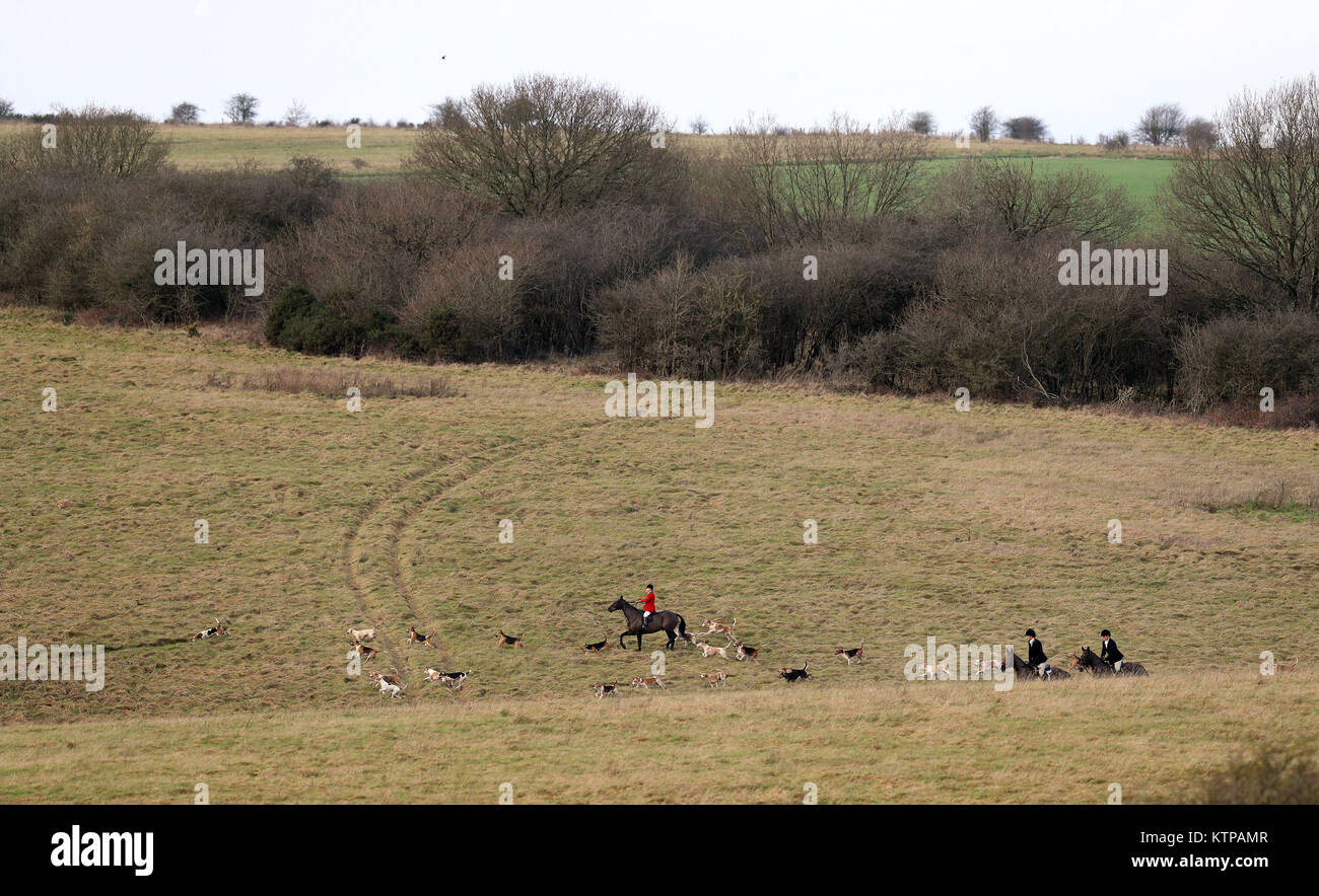 Riders pass over Salisbury Plain during the Tedworth Boxing Day hunt in ...